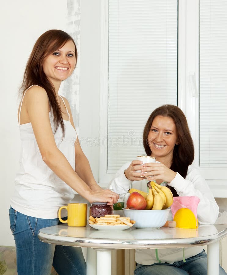 Women have tea in kitchen stock image. Image of cheerful - 24333435