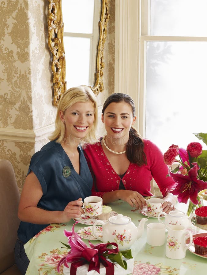 Women Having Tea at Dining Table Stock Photo - Image of holding ...