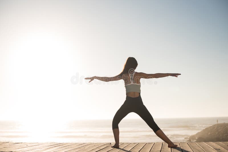 Women Doing Pilates on the Beach Stock Photo - Image of body, beach ...
