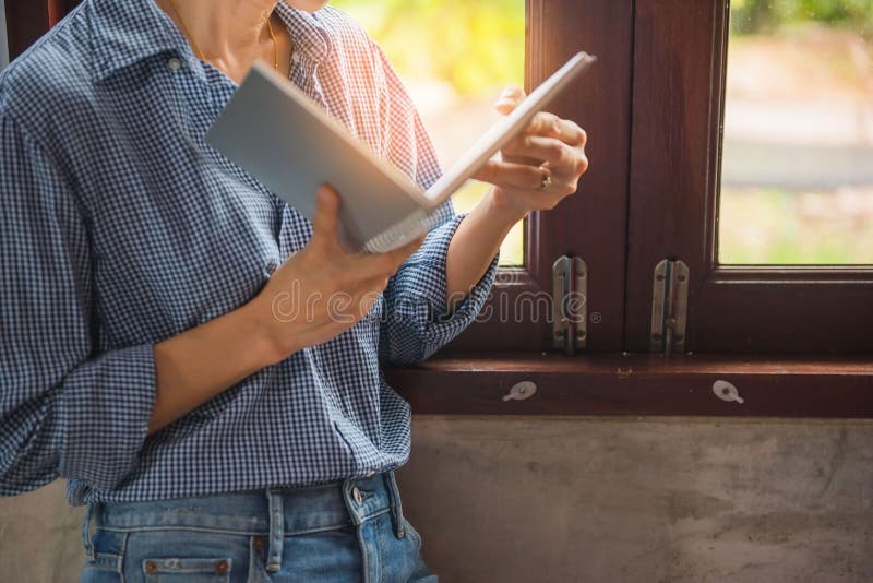 Women Hold Books in Hand in the Library Stock Photo - Image of ...