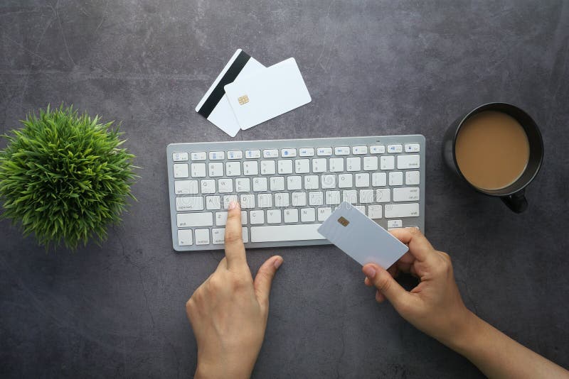 Women Hold Credit Card in Hand and Typing Security Code on Keyboard ...