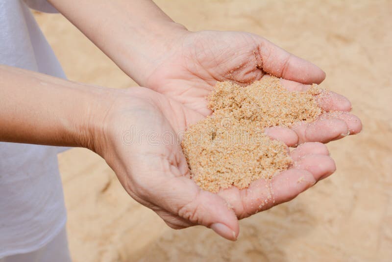 Women holding the sand stock image. Image of sand, grab - 47394499