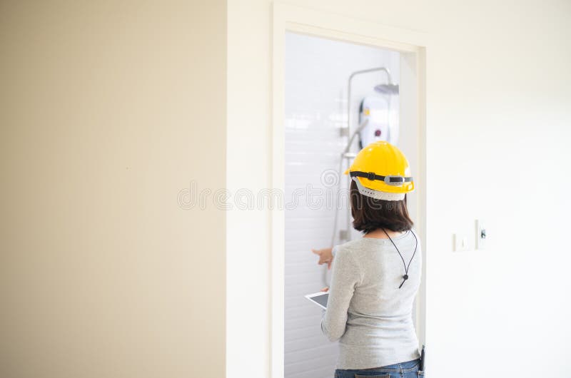Women Home Inspector Surveyor Wearing Vests and Hard Hat at New House ... Women Home Inspector Surveyor Wearing Vests and Hard Hat at New House ...