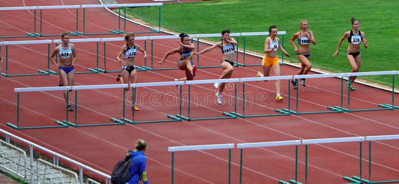 Women at the hurdles race editorial image. Image of activities - 27539780