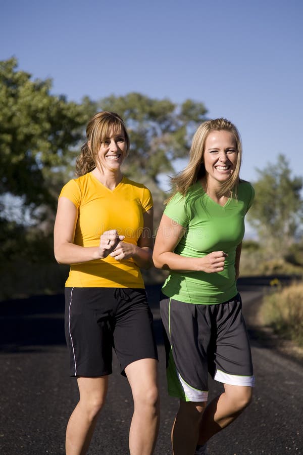 Women running on road stock photo. Image of health, black - 11122114