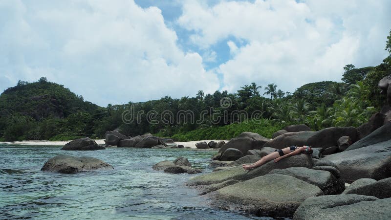 Women Laying on Rocks at the Seychelles Editorial Image - Image of ...
