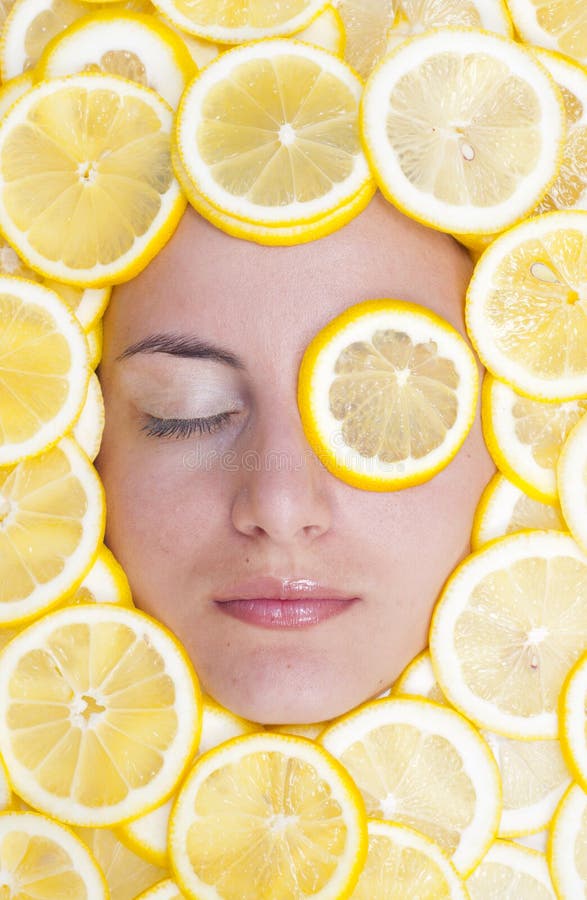 Women with lemons on face stock image. Image of girl - 22939479
