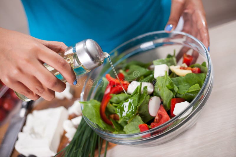 Women making fresh salad stock photo. Image of home, casual - 77670696