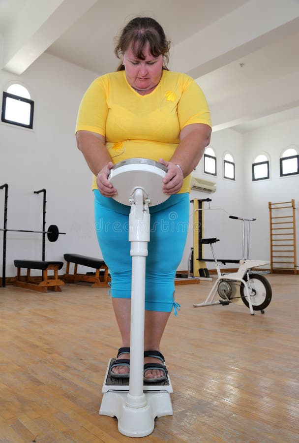 Women with Overweight on Scales in Gym Stock Photo - Image of trainers ...