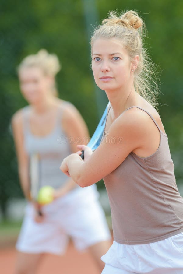 Women Playing Tennis Doubles Stock Photo - Image of concentration ...