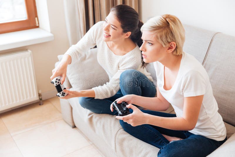 Women playing video games stock photo. Image of female - 71512718