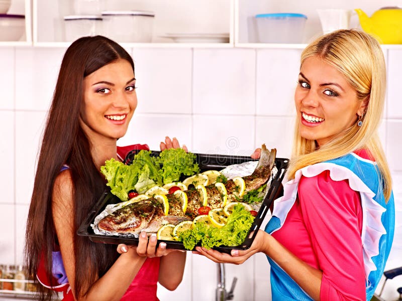 Women Prepare Fish in Oven. Stock Photo - Image of cook, cooking: 45149078