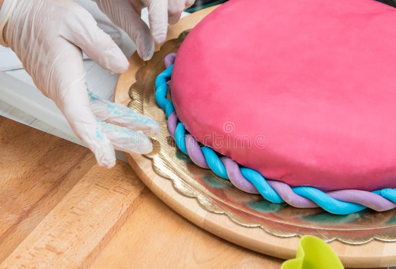 Women Preparing and Decorating a Cake with Sugar Paste Stock Image ...