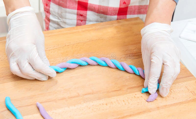 Women Preparing and Decorating a Cake with Sugar Paste Stock Image ...