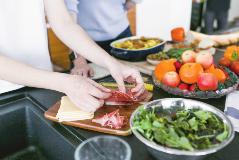 Women Preparing Dinner at Kitchen with Jamon Stock Image - Image of ...