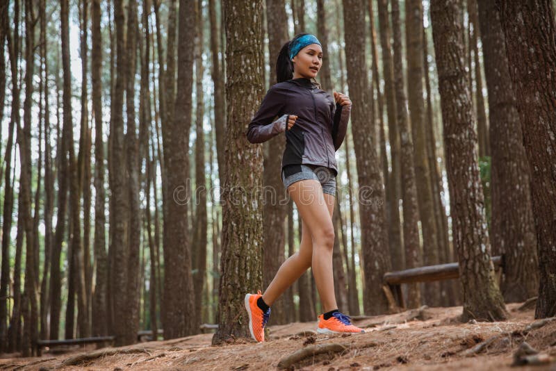 A woman ran in forest stock image. Image of alone, person - 130434617