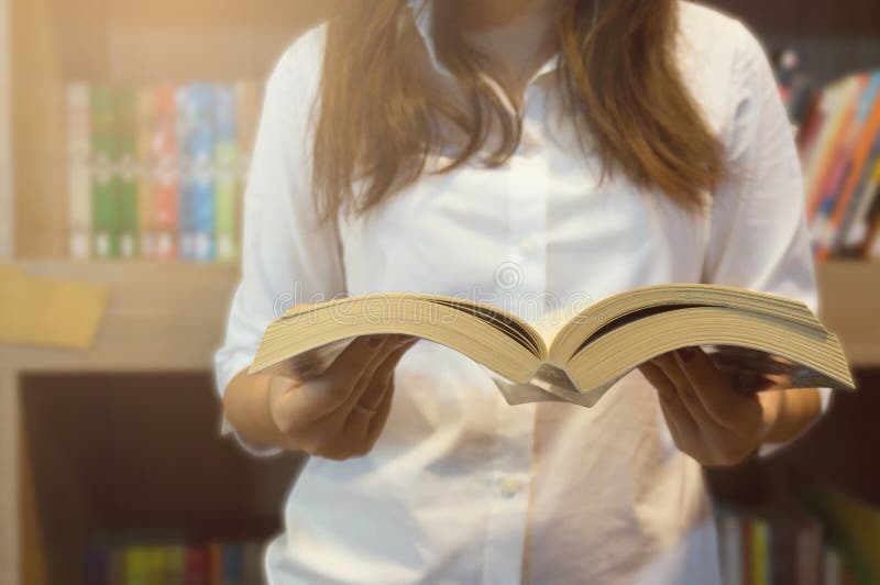 Women Reading Book and Relaxing in Library. Selective Focus Stock Image ...