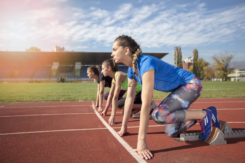 Women Ready To Race On Track Field Stock Image - Image of olympic ...
