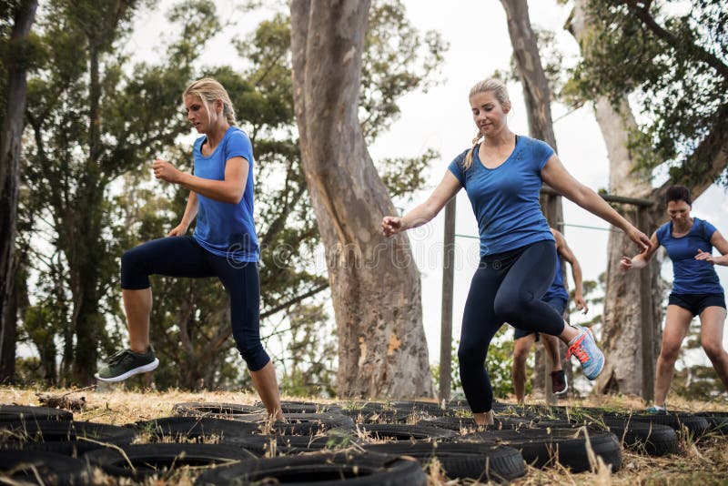 Women Receiving Tire Obstacle Course Training Stock Image - Image of ...