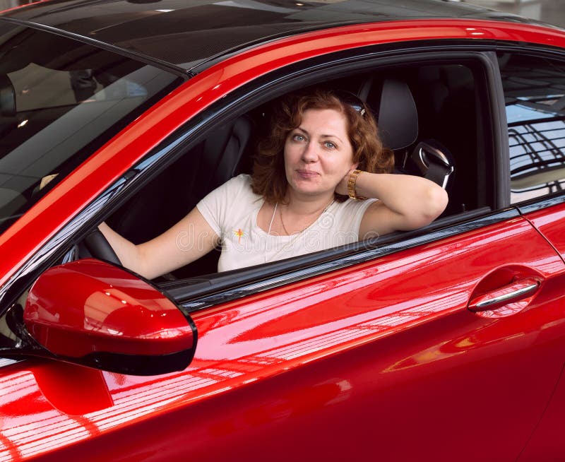Women in red car stock photo. Image of auto, business - 60109558