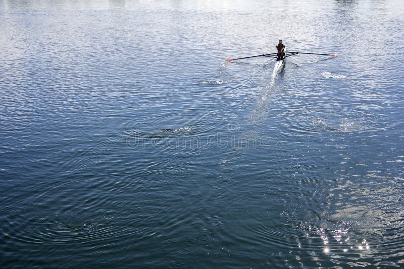 Women rowing in a lake editorial stock image. Image of scull - 53714964