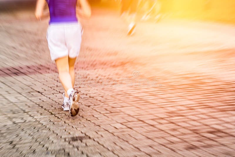 Women running in motion. stock photo. Image of energy - 68442230