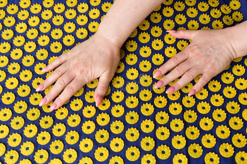 Women& X27;s Arm on a Needle Mat - Massage Using an Applicator ...