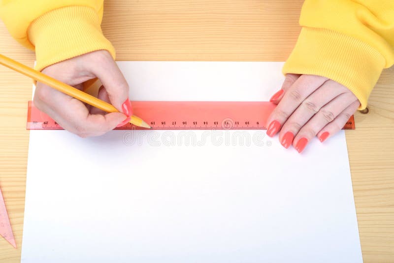 Women S Hands Hold a Ruler and a Pencil for Drawing Lines. Stock Image ...