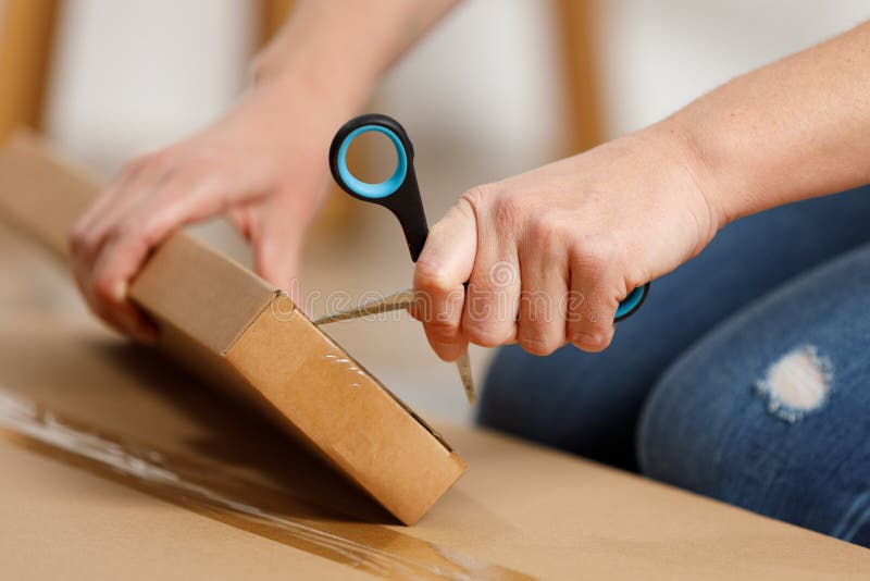 Women S Hands Open a Cardboard Box with Scissors, a Parcel Stock Photo ...