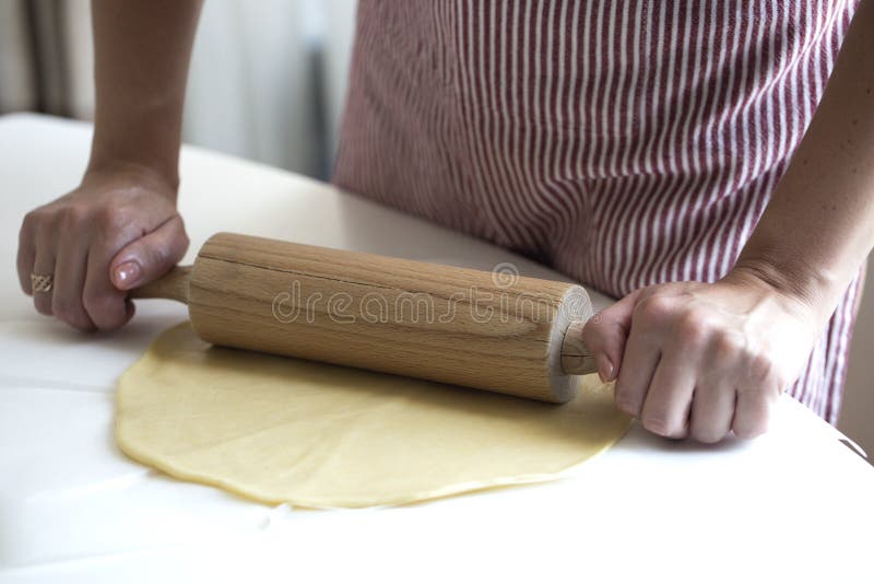 Women`s Hands with Rolling Pin. Women`s Hands Roll the Dough on Stock ...