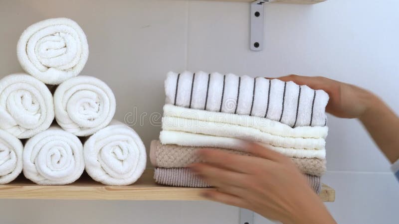 Women S Hands Stack a Stack of Clean Towels on a Shelf. Stock Video ...