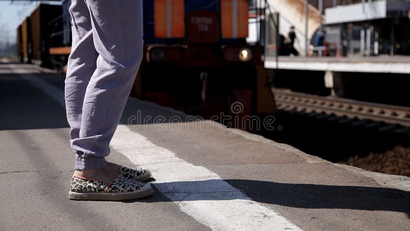Women`s Legs on the Railway Platform Waiting for the Train. in the ...