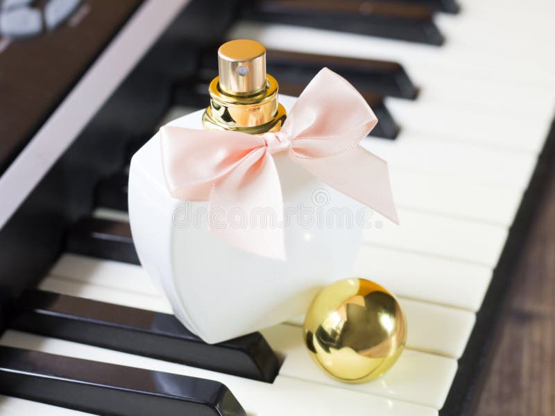 Women`s Perfume with a Bow on the Piano Stock Image - Image of romance ...