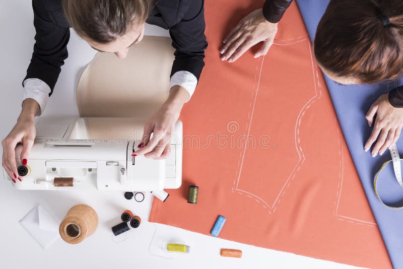 Women sewing together stock photo. Image of machine, empty - 80443804