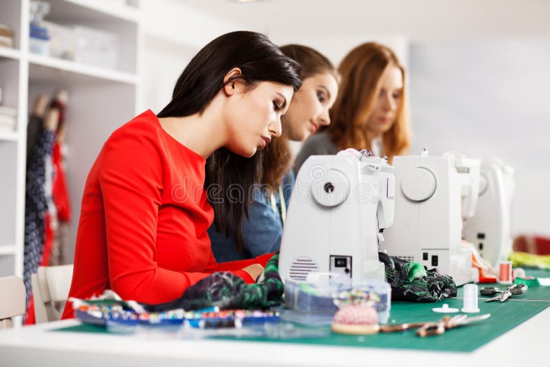 Women in a sewing workshop stock photo. Image of attractive - 64934142