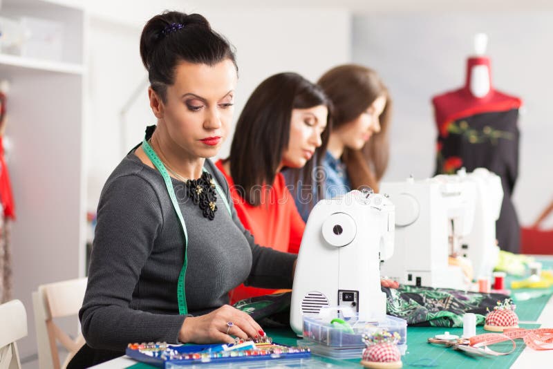 Women in a sewing workshop stock image. Image of craft - 65241017