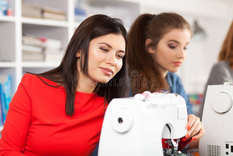 Women in a sewing workshop stock photo. Image of designer - 65677240