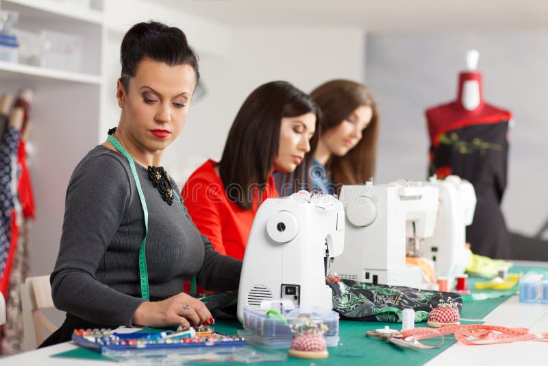Women in a sewing workshop stock photo. Image of clothes - 62812094