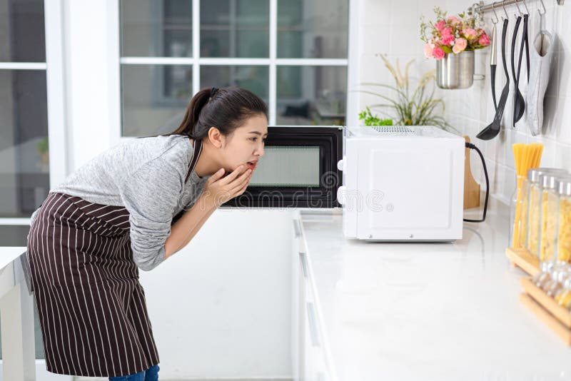 Women Shock, Cooking from the Microwave Stock Photo - Image of ...