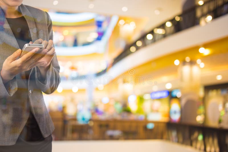 Women in Shopping Mall Using Mobile Phone. Stock Photo - Image of ...