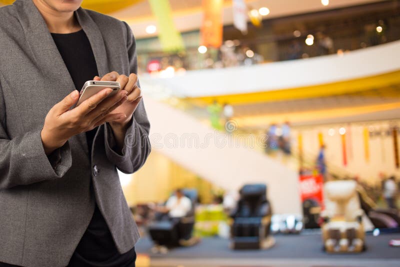 Women in Shopping Mall Using Mobile Phone. Stock Image - Image of smart ...