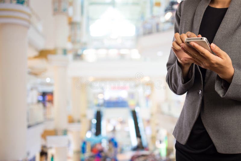 Women in Shopping Mall Using Mobile Phone. Stock Photo - Image of ...
