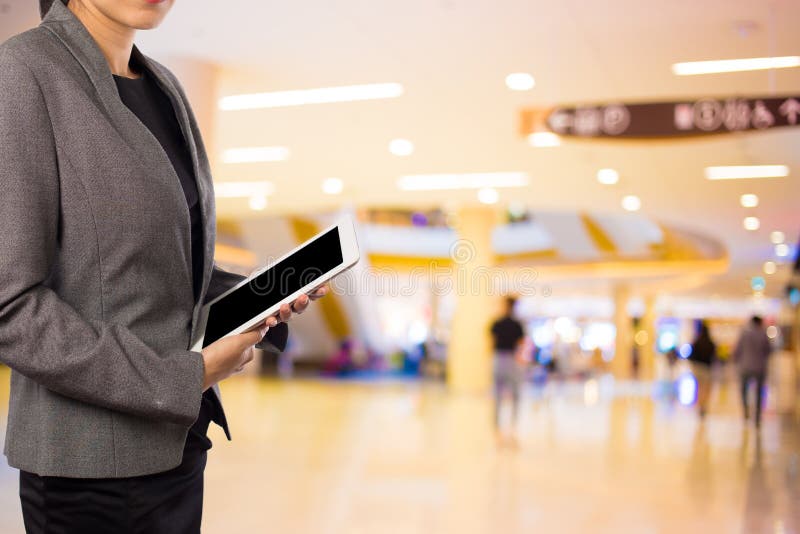 Women in Shopping Mall Using Mobile Tablet PC. Stock Image - Image of ...