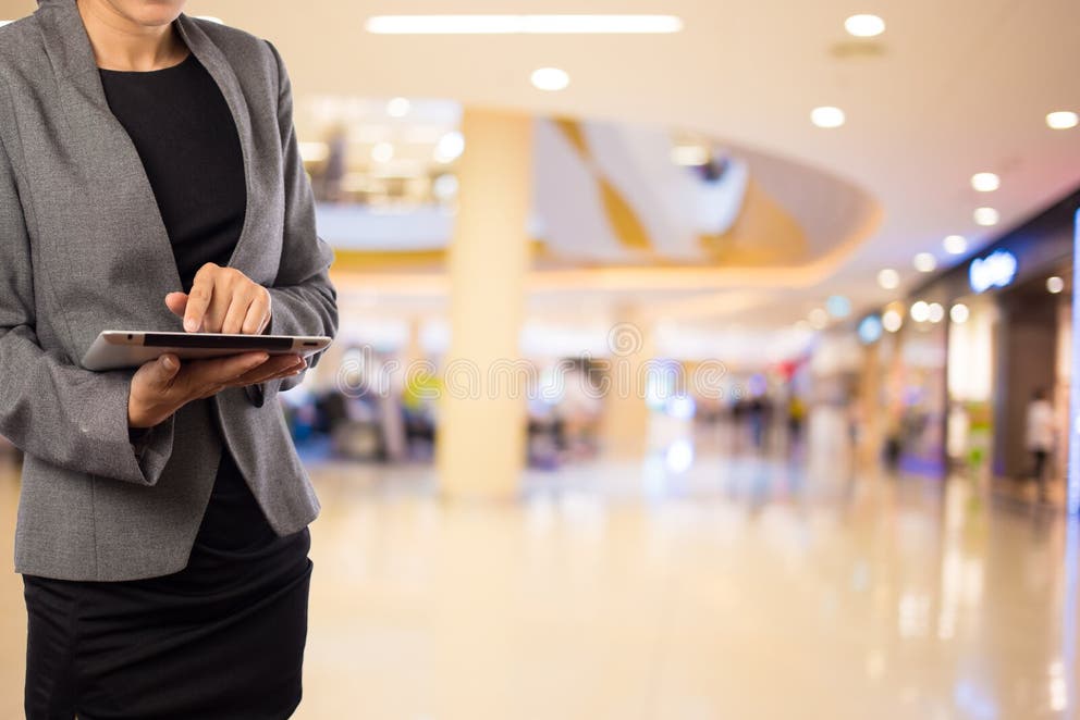 Women in Shopping Mall Using Mobile Tablet PC. Stock Image - Image of ...