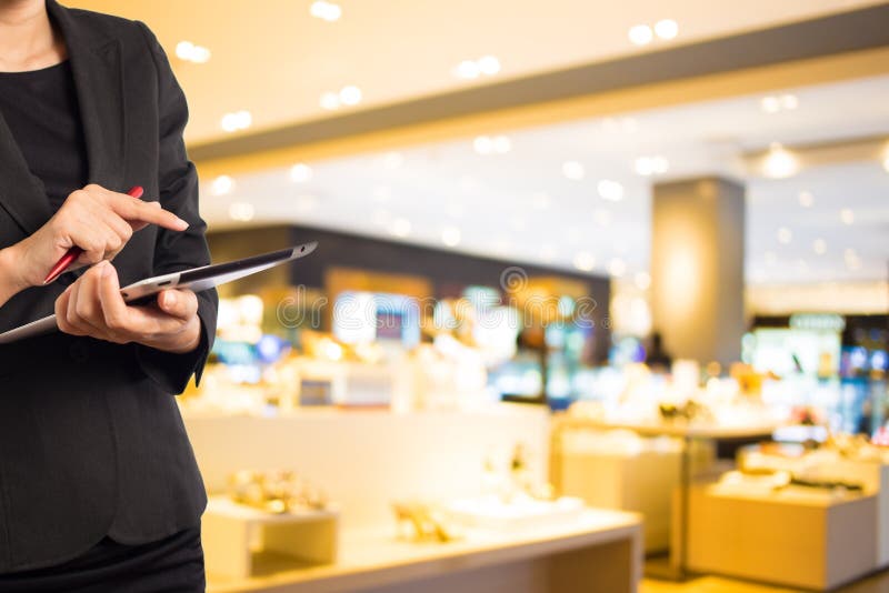 Women in Shopping Mall Using Mobile Tablet PC. Stock Image - Image of ...