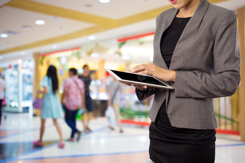 Women in Shopping Mall Using Mobile Tablet PC. Stock Image - Image of ...