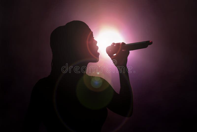 Women Singing Under Spotlight Stock Photos - Free & Royalty-Free Stock ...