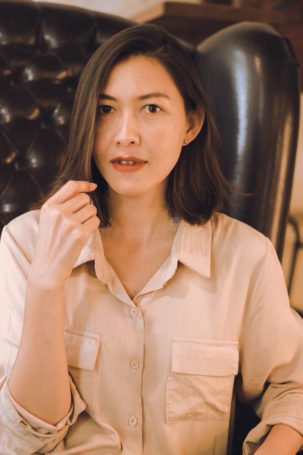 Women Sitting on a Black Leather Sofa Stock Image - Image of drunk ...