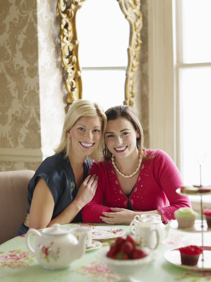 Women Sitting Dining Table stock image. Image of london - 33898985