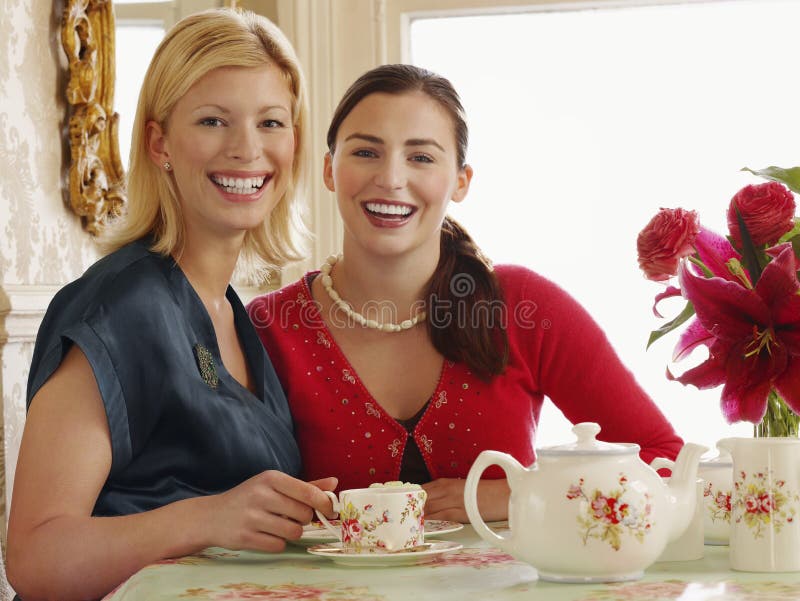 Women Sitting Dining Table stock image. Image of indoors - 33906477